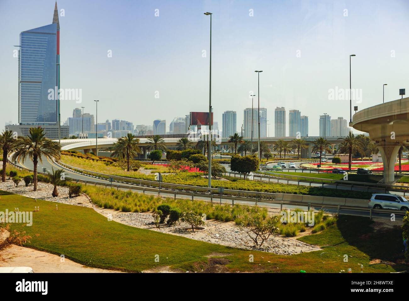 Asphalt road with modern city skyline of Dubai Stock Photo - Alamy