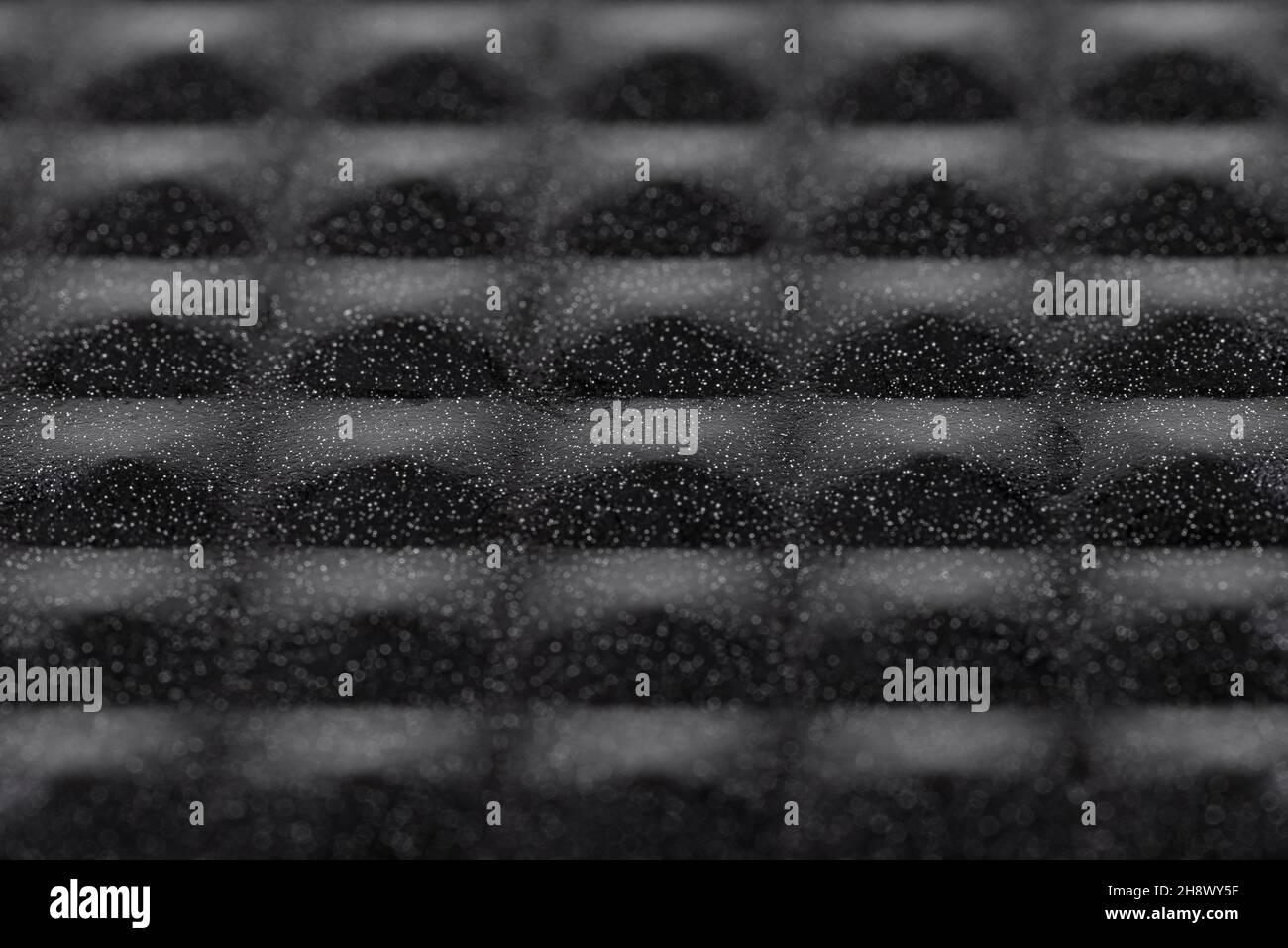 Background made of a macro photo with a smooth diamond-shaped black ...