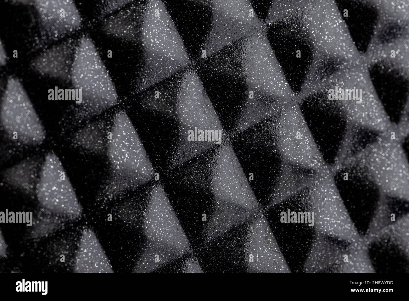 Background made of a macro photo with a smooth diamond-shaped black ...