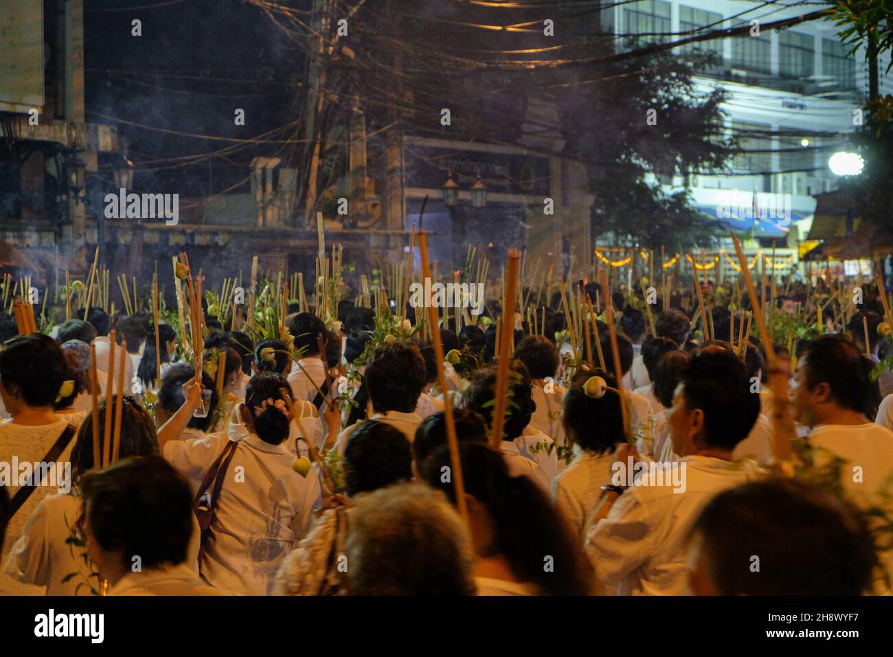 BANGKOK, THAILAND - Nov 28, 2021: Procession of people with candles ...