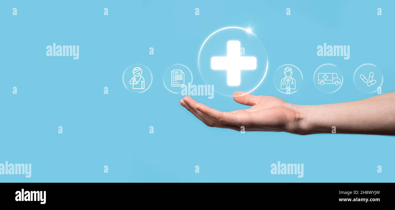Businessman hold virtual plus medical network connection icons. Covid ...
