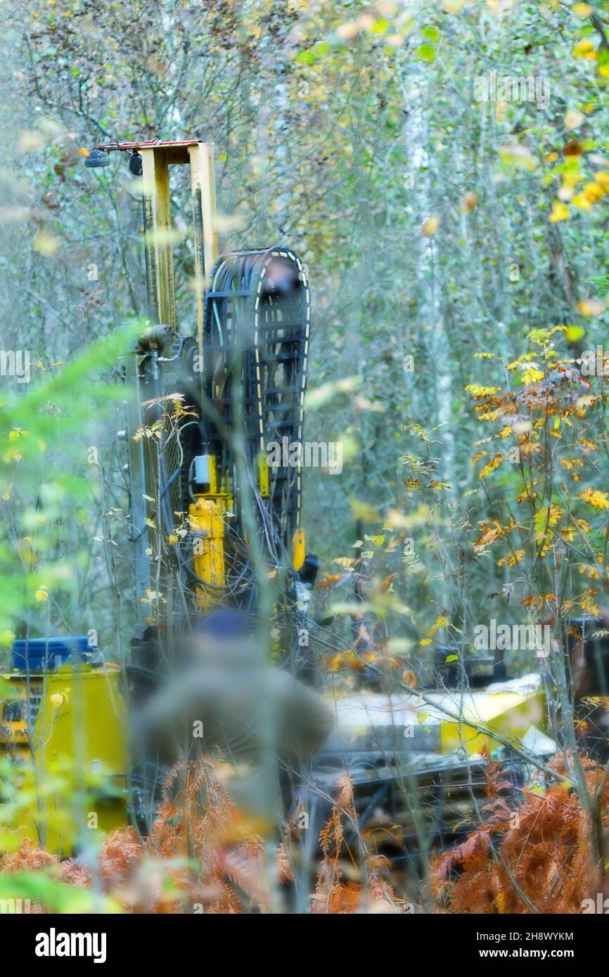 Self-propelled Mini-drilling rig drills the soil in forest conditions ...