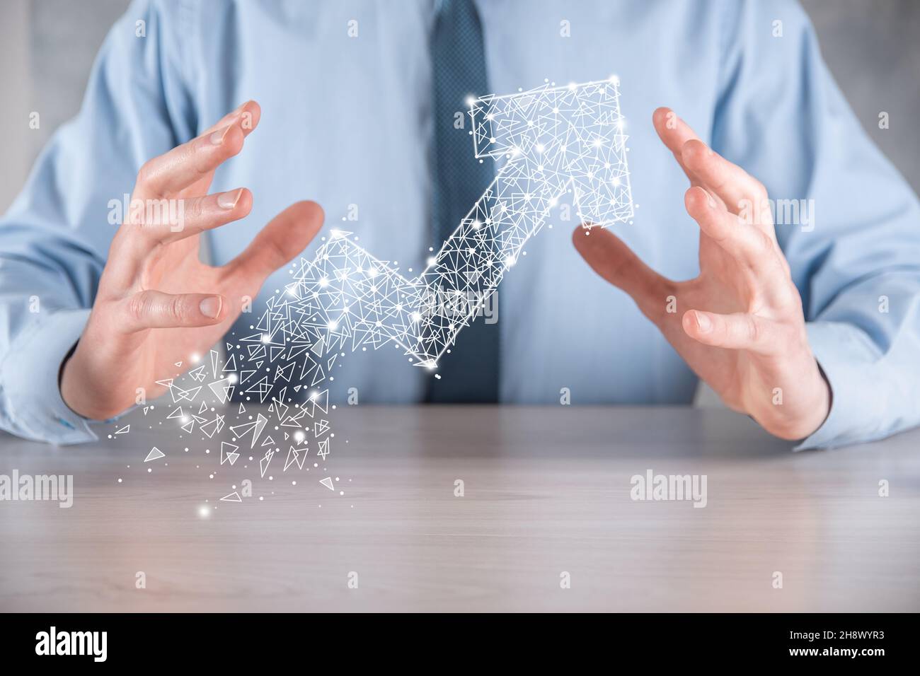 Businessman hold graph, arrow of positive growth icon.pointing at ...