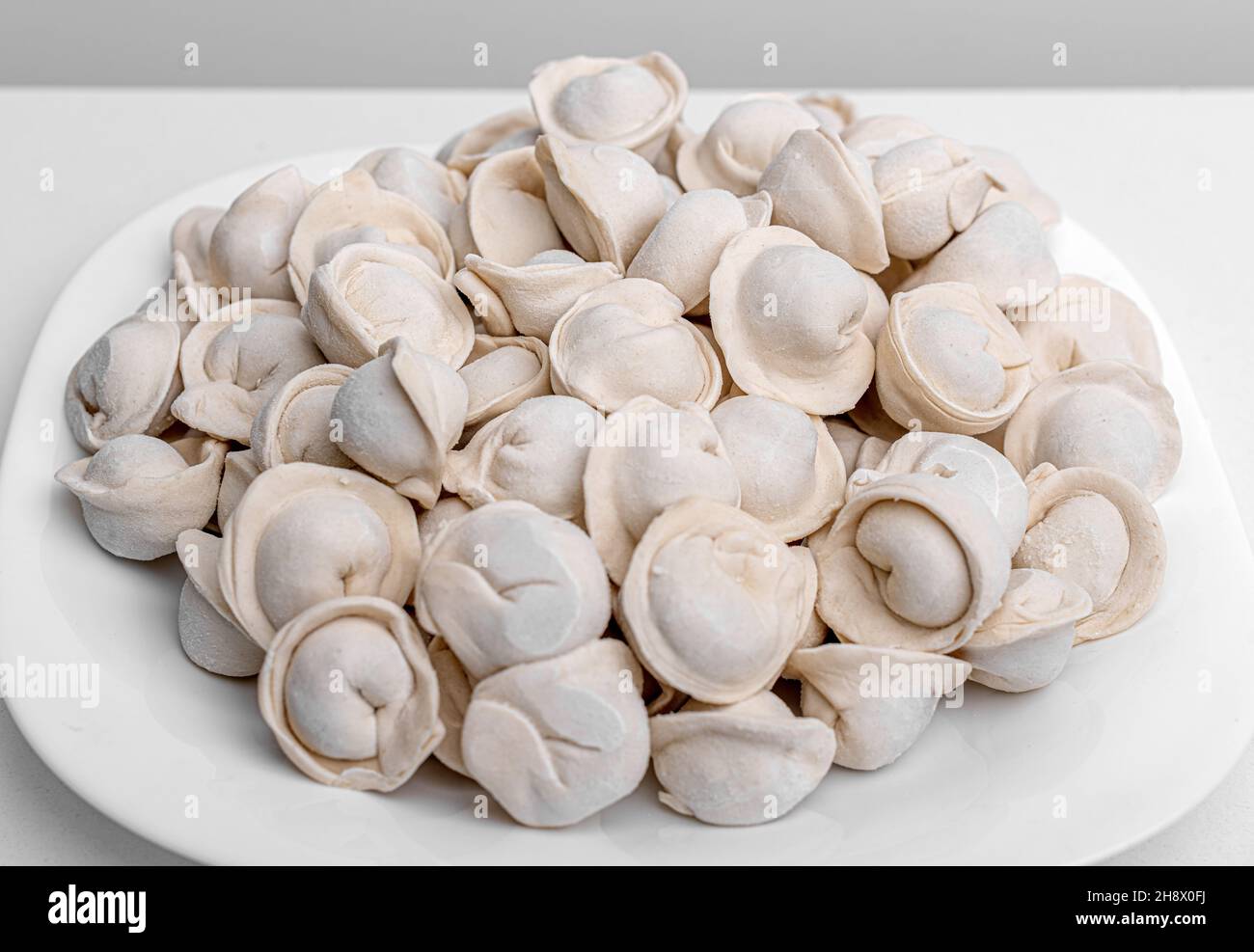 Raw dumplings close up Stock Photo - Alamy