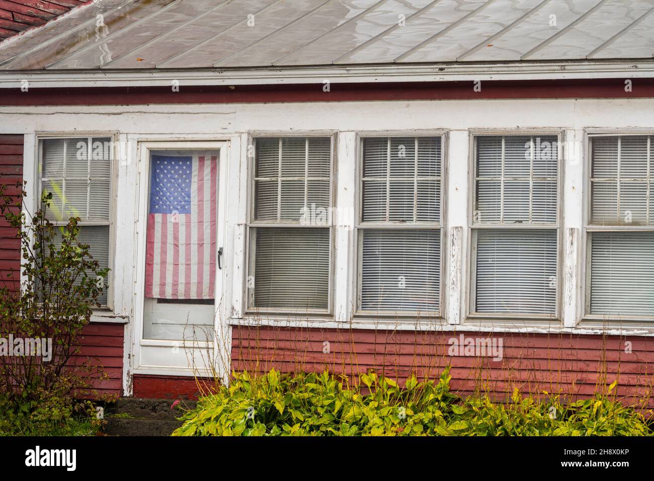 Windows with flag, Along US 2, New Hampshire, USA Stock Photo - Alamy