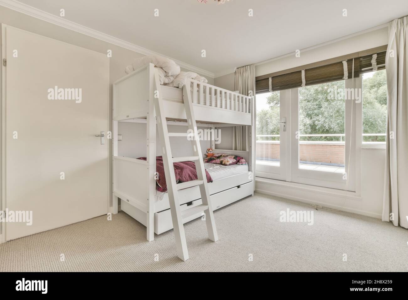 White children bunk bed with wooden ladder placed near window in light ...