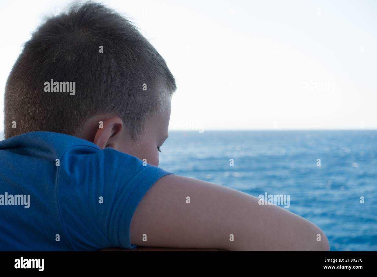 boy on a ship sets sail in the blue sea Stock Photo - Alamy