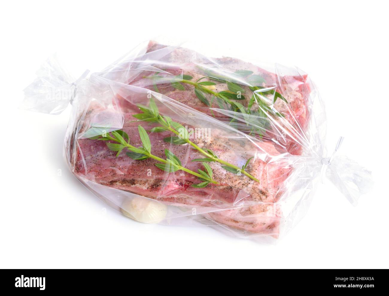 Fresh meat packaged in a special sleeve for baking. Pork belly with ...