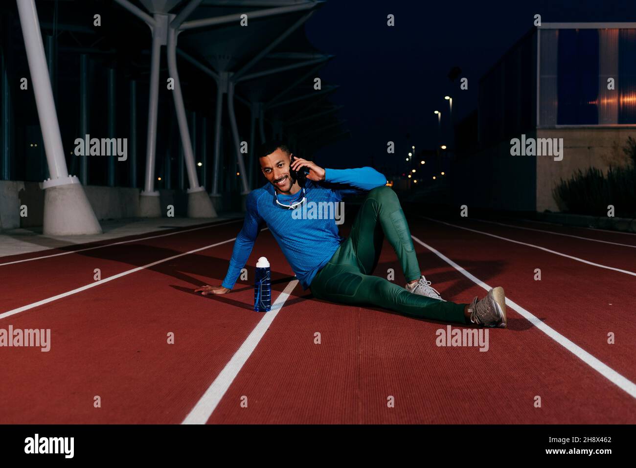 Man running outdoors using smart hi-res stock photography and images ...
