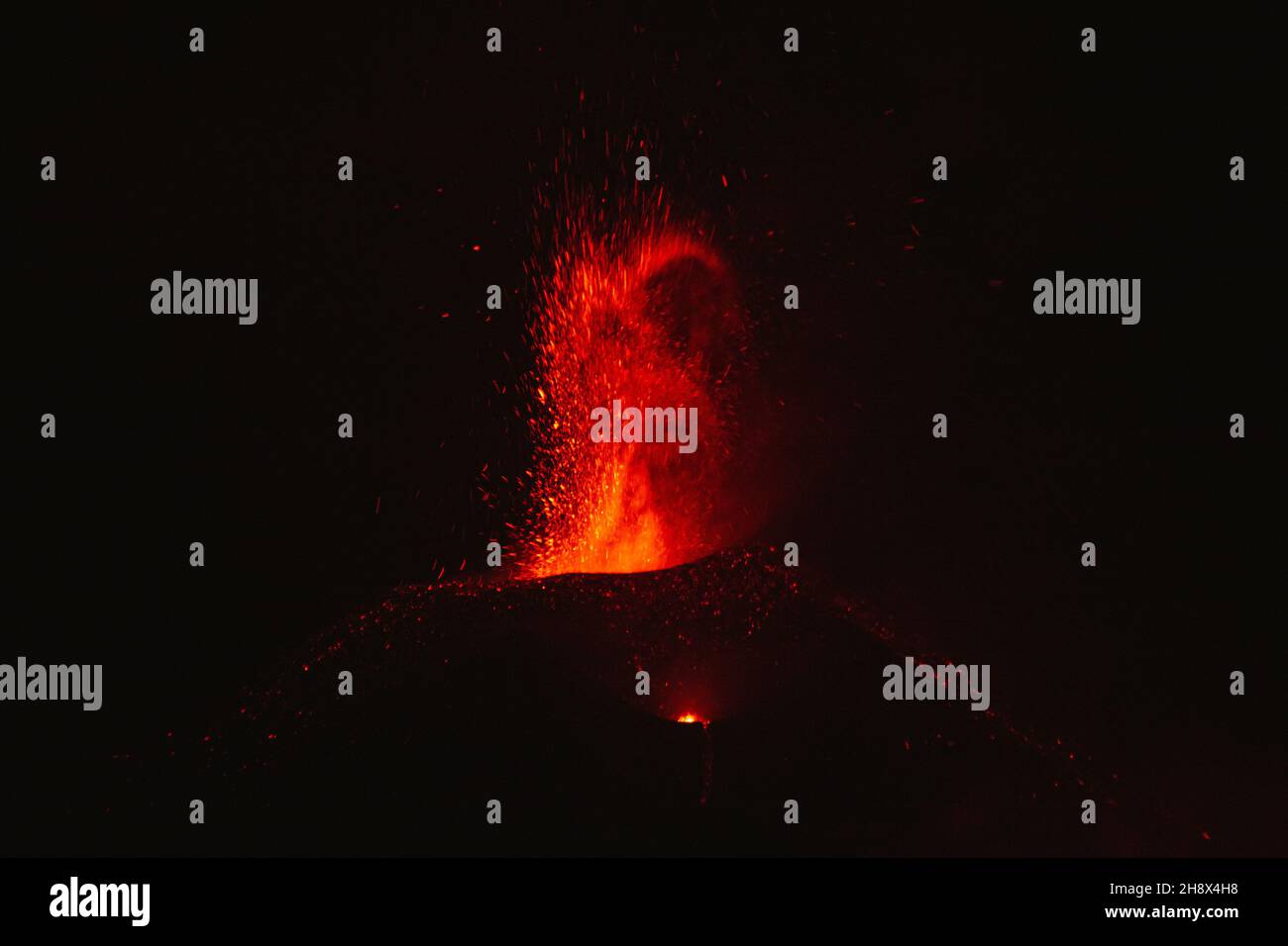 Breathtaking scenery of hot bright orange lava pouring out of erupting ...