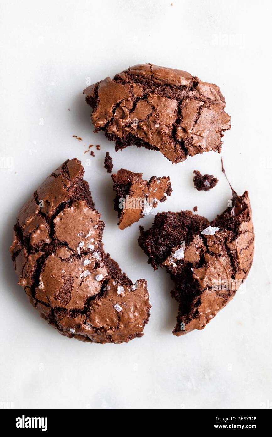 Top view of homemade baked broken sweet chocolate brownie cookie with ...