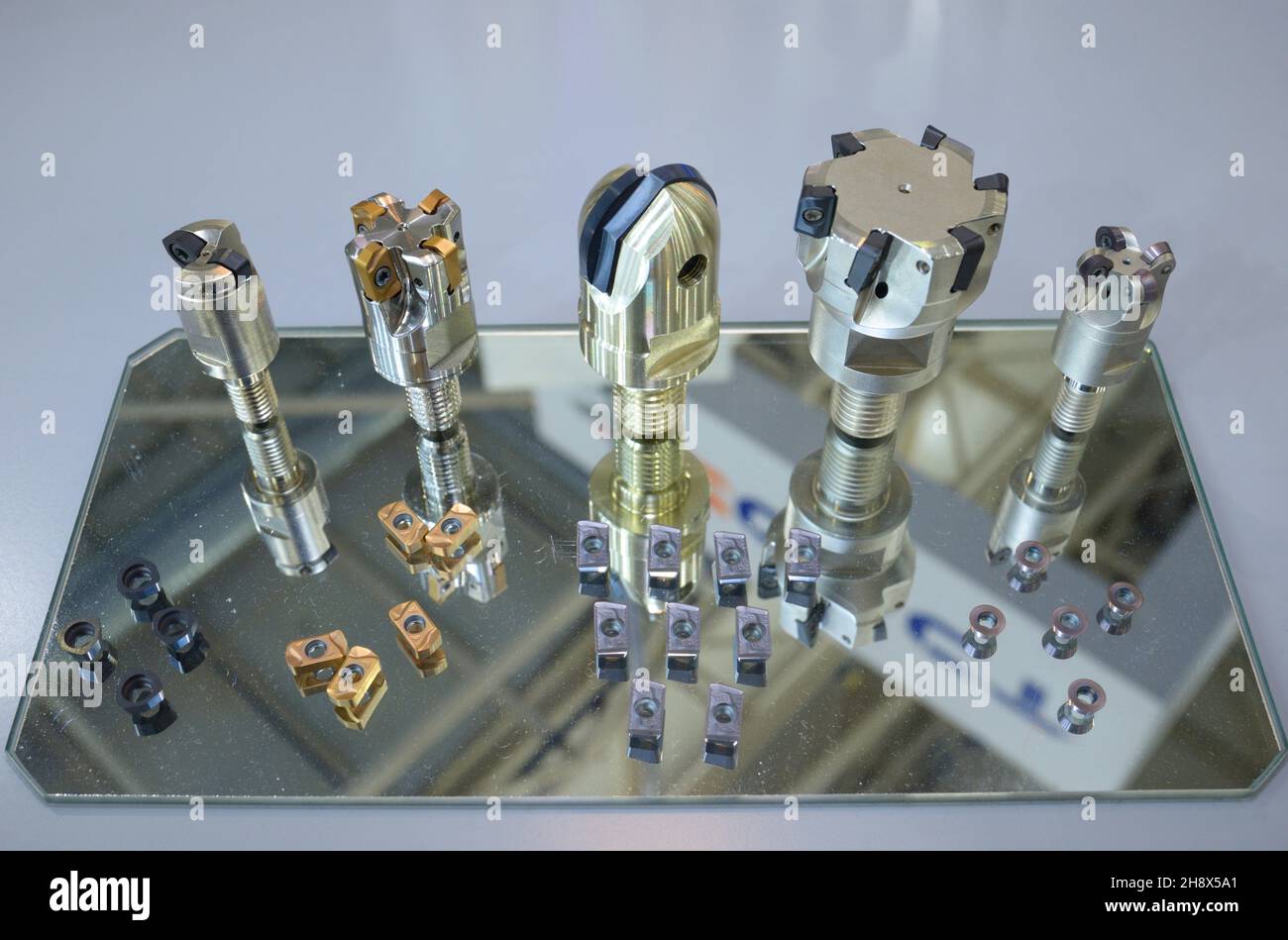 Modern milling cutters placed on stand Stock Photo - Alamy