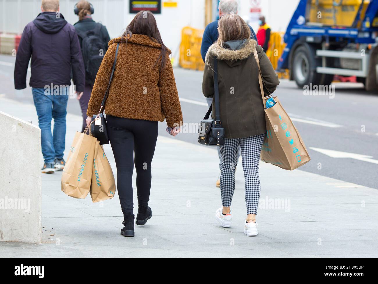 Shoppers walk in central London Stock Photo - Alamy