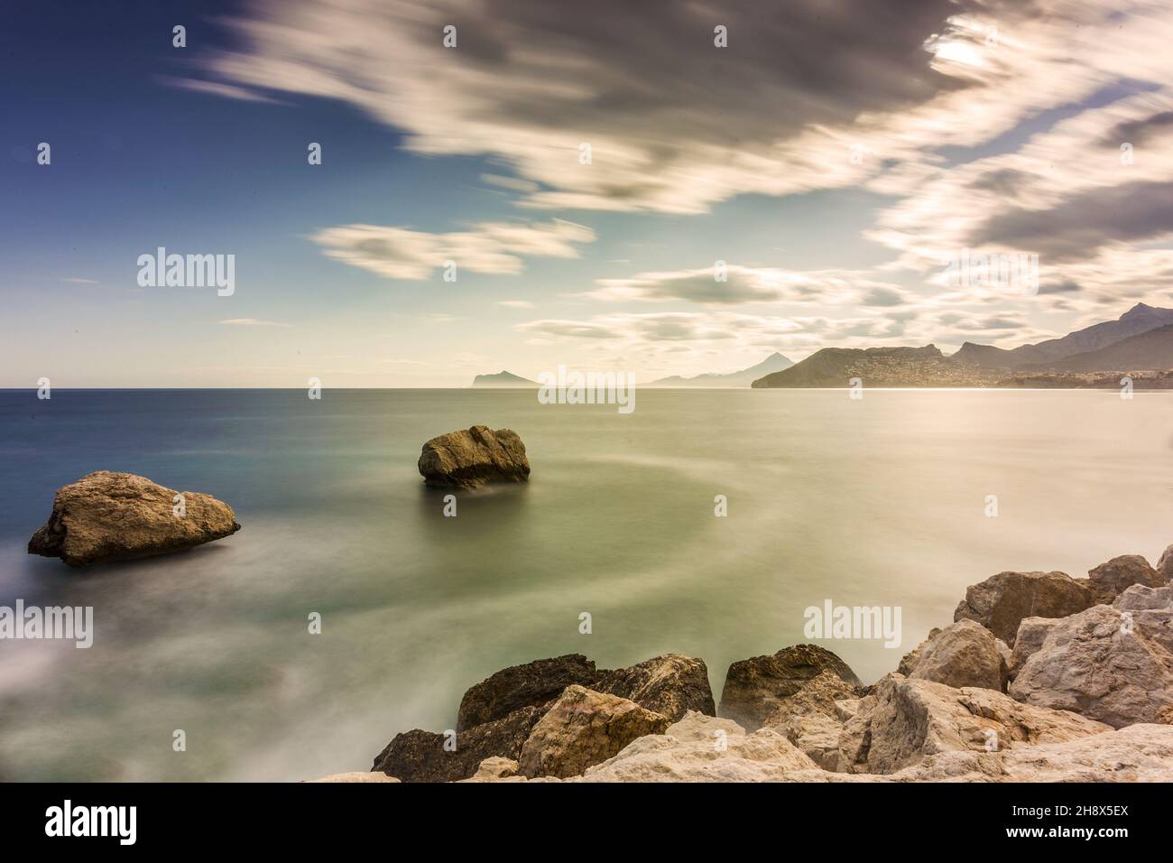 Beautiful scene of rocks in the water on the beach Stock Photo - Alamy