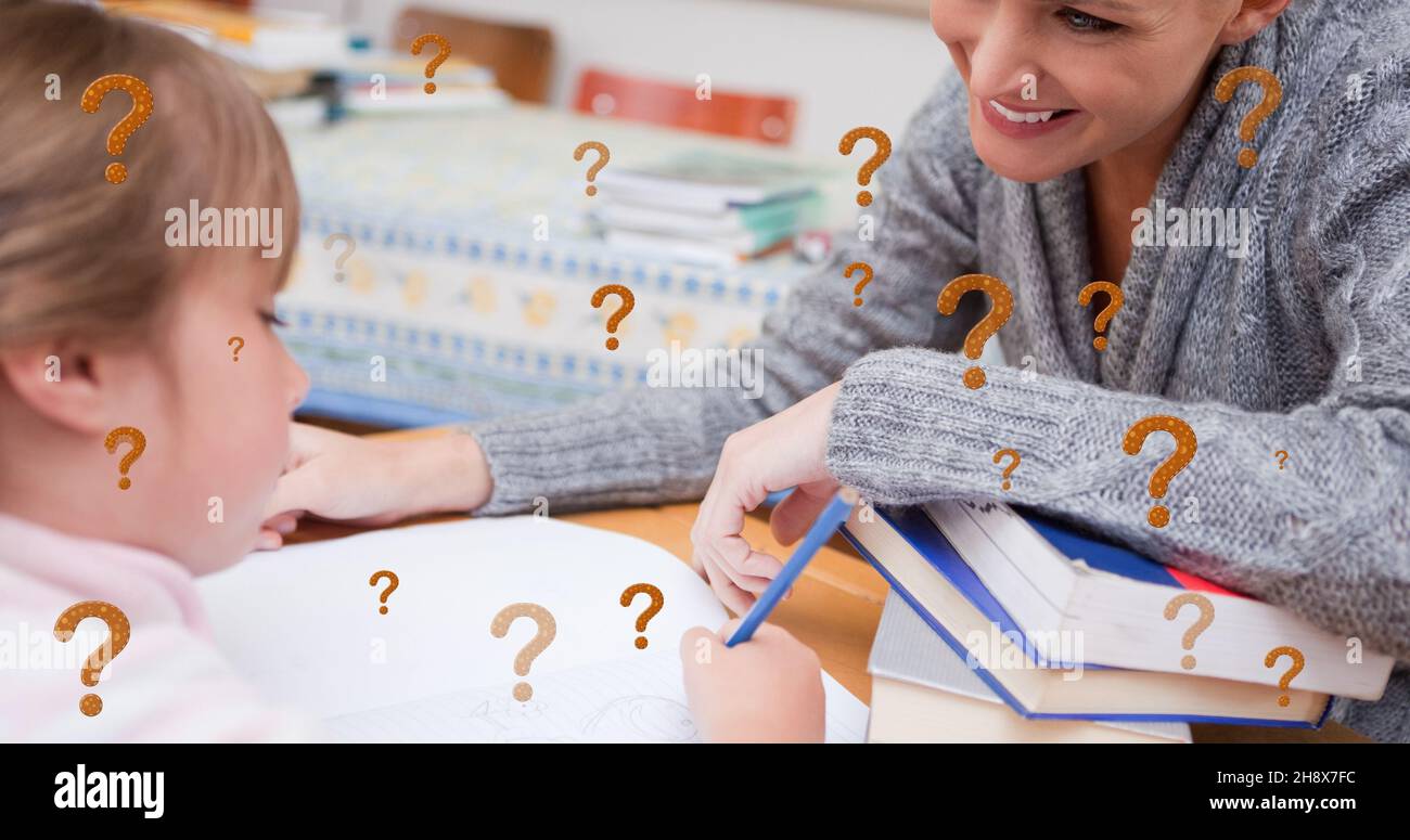Digital composite of question marks over smiling teacher helping ...