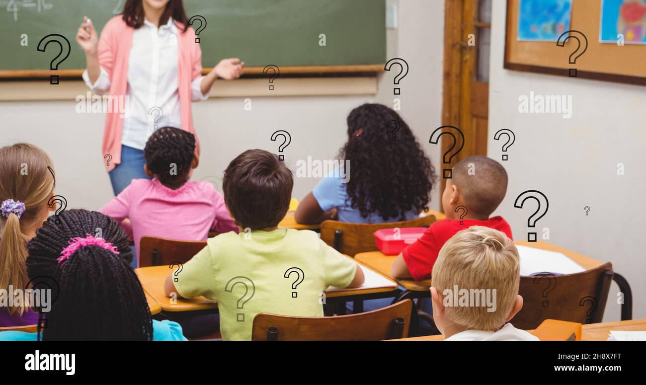 Digital composite of question marks over teacher explaining students ...