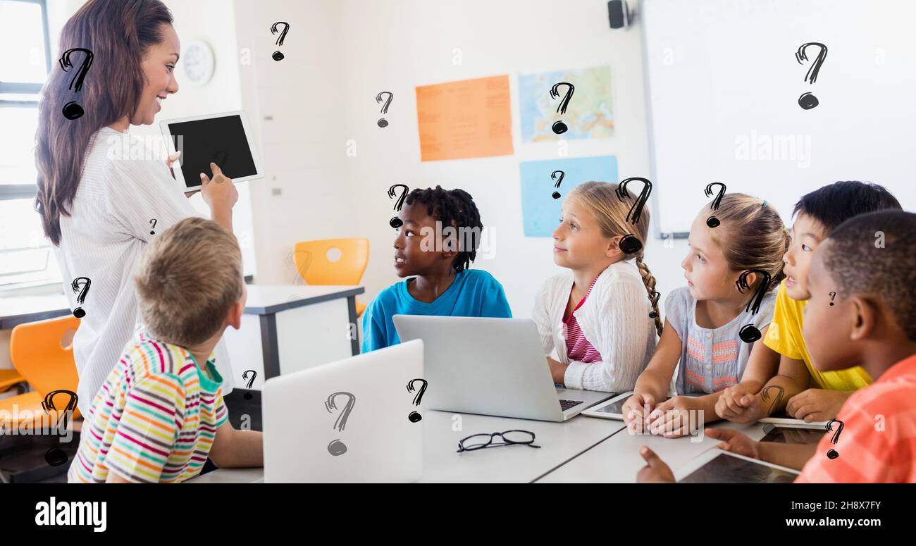 Digital composite of question marks over teacher showing tablet pc to ...