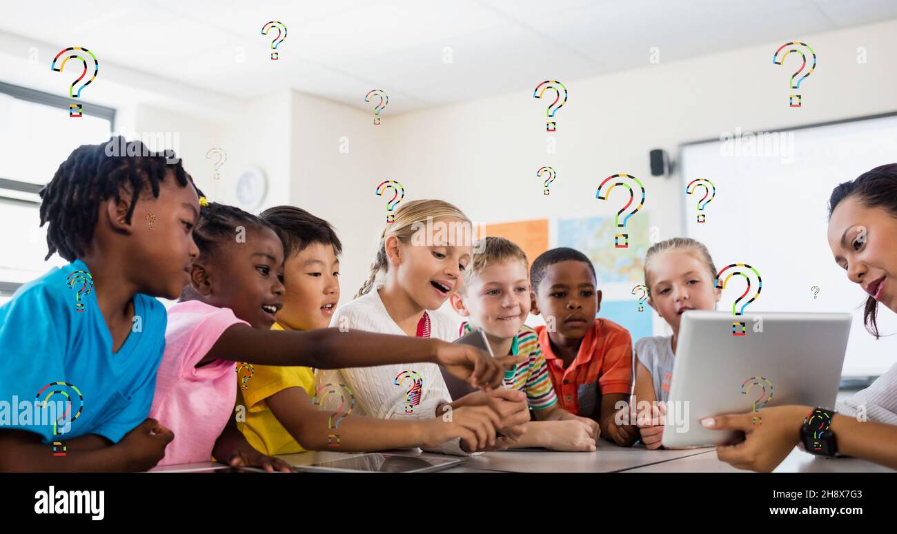 Digital composite of question marks over teacher showing tablet pc to ...
