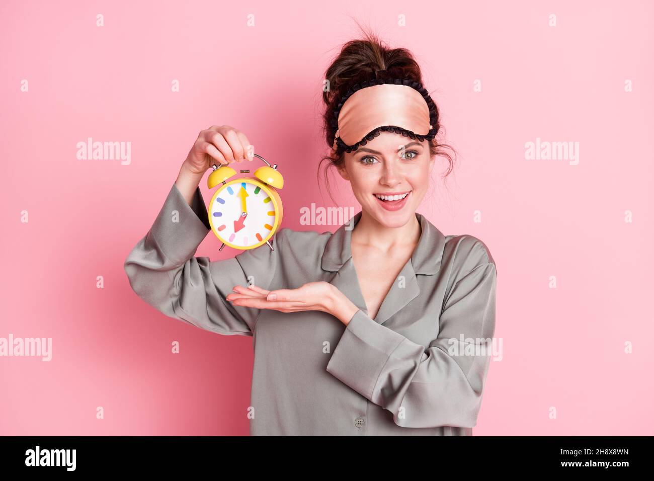 Photo of young girl happy positive smile show timer clock watch ...