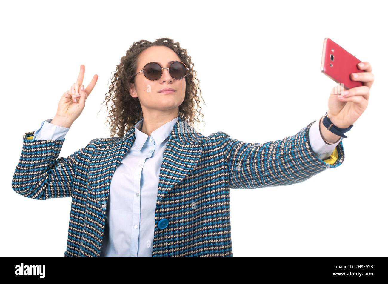 of a cute lovely woman taking selfie and showing peace sign with ...