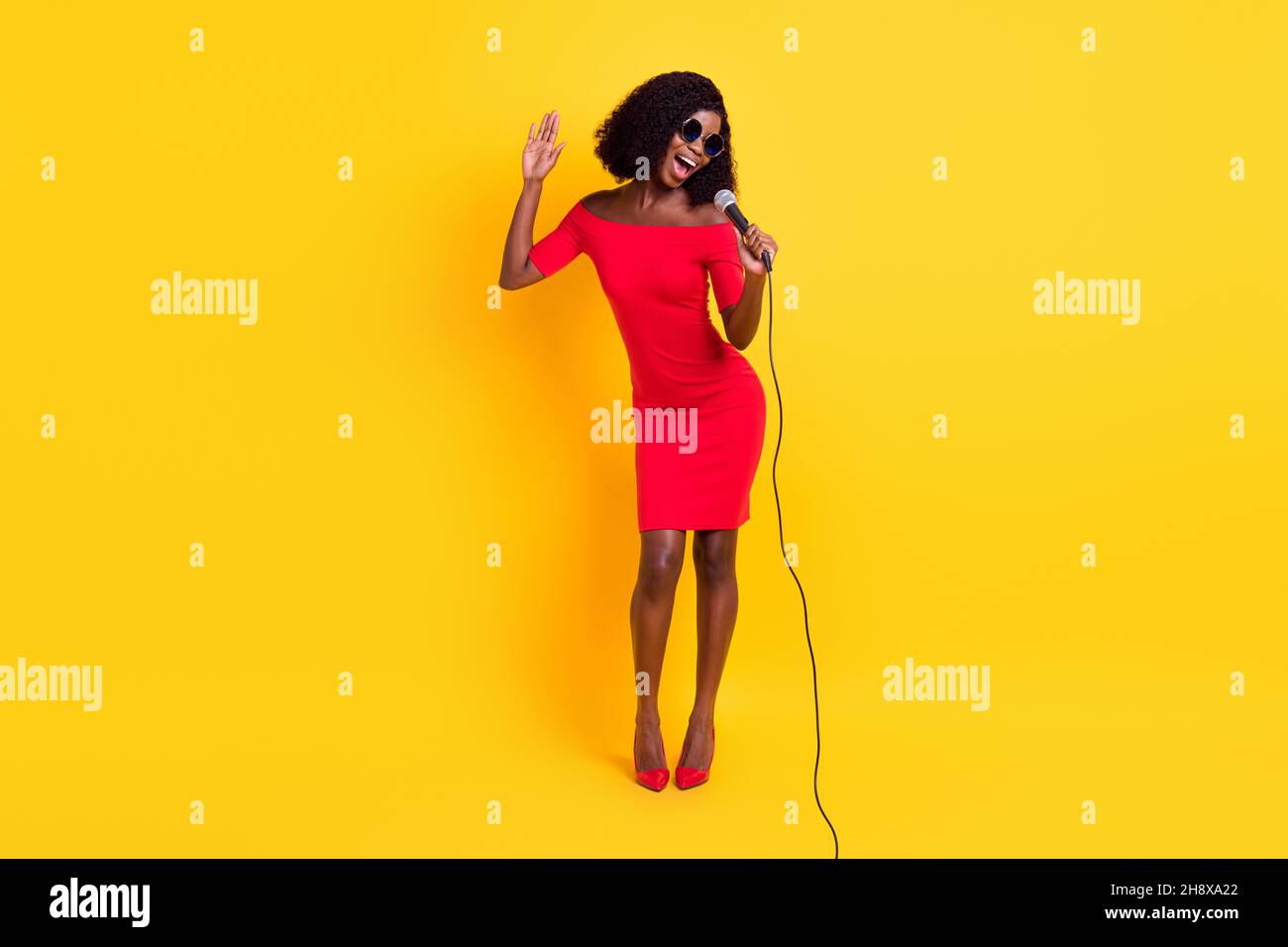 Full length body size view of gorgeous thin girl singing pop hit song ...