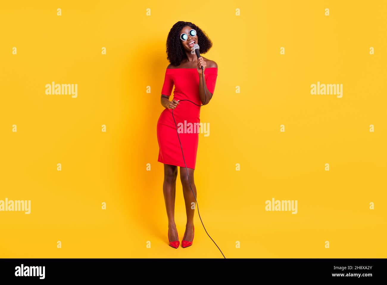 Full length body size view of charming thin cheery girl singing pop hit ...