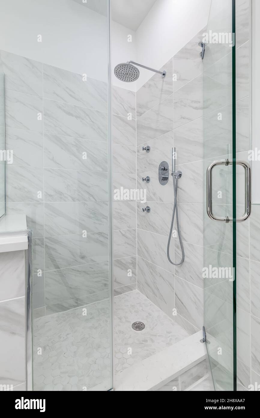Modern White Bathroom with Gray Marble Tile, Glass Shower Door, and ...