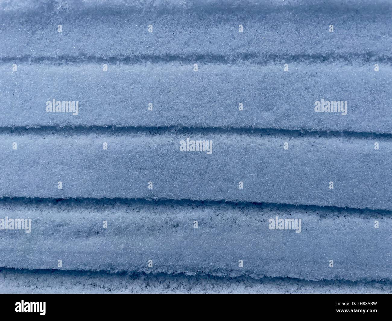 Profile of sledge on snow-covered road. Close up, wallpaper background ...