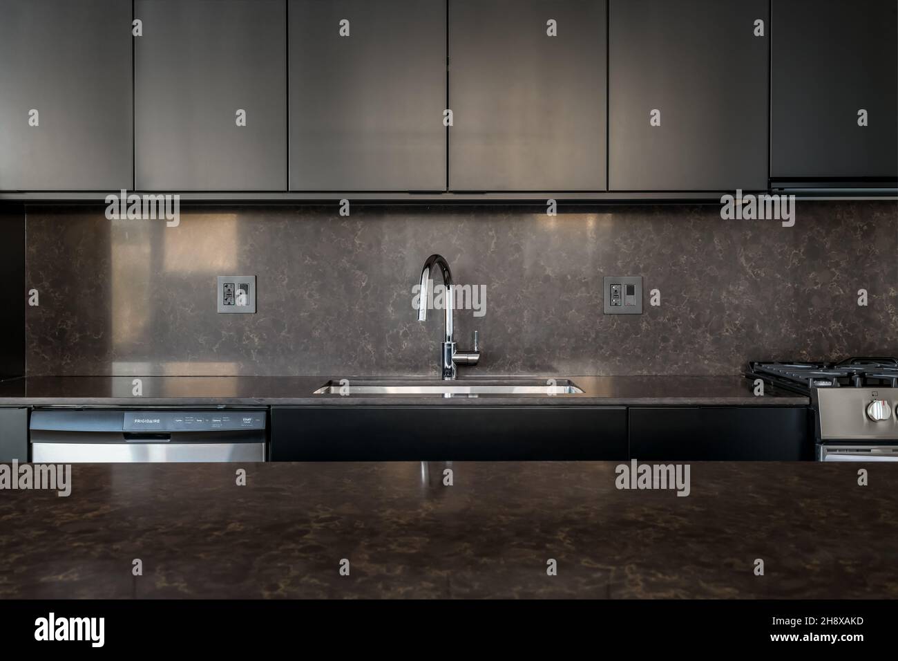 Closeup of Sink and Faucet in Dark Brown Kitchen Stock Photo - Alamy