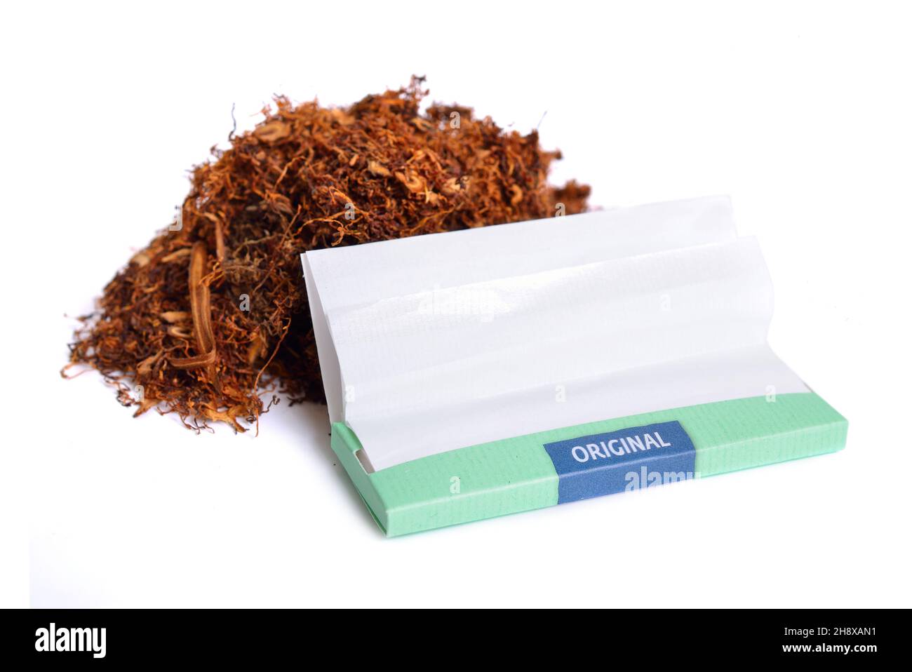 Ready-rubbed tobacco witp paper. Isolated on white background Stock ...