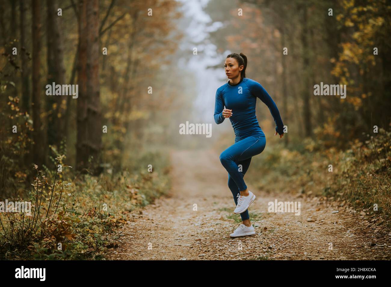 Young woman running on country hi-res stock photography and images - Alamy