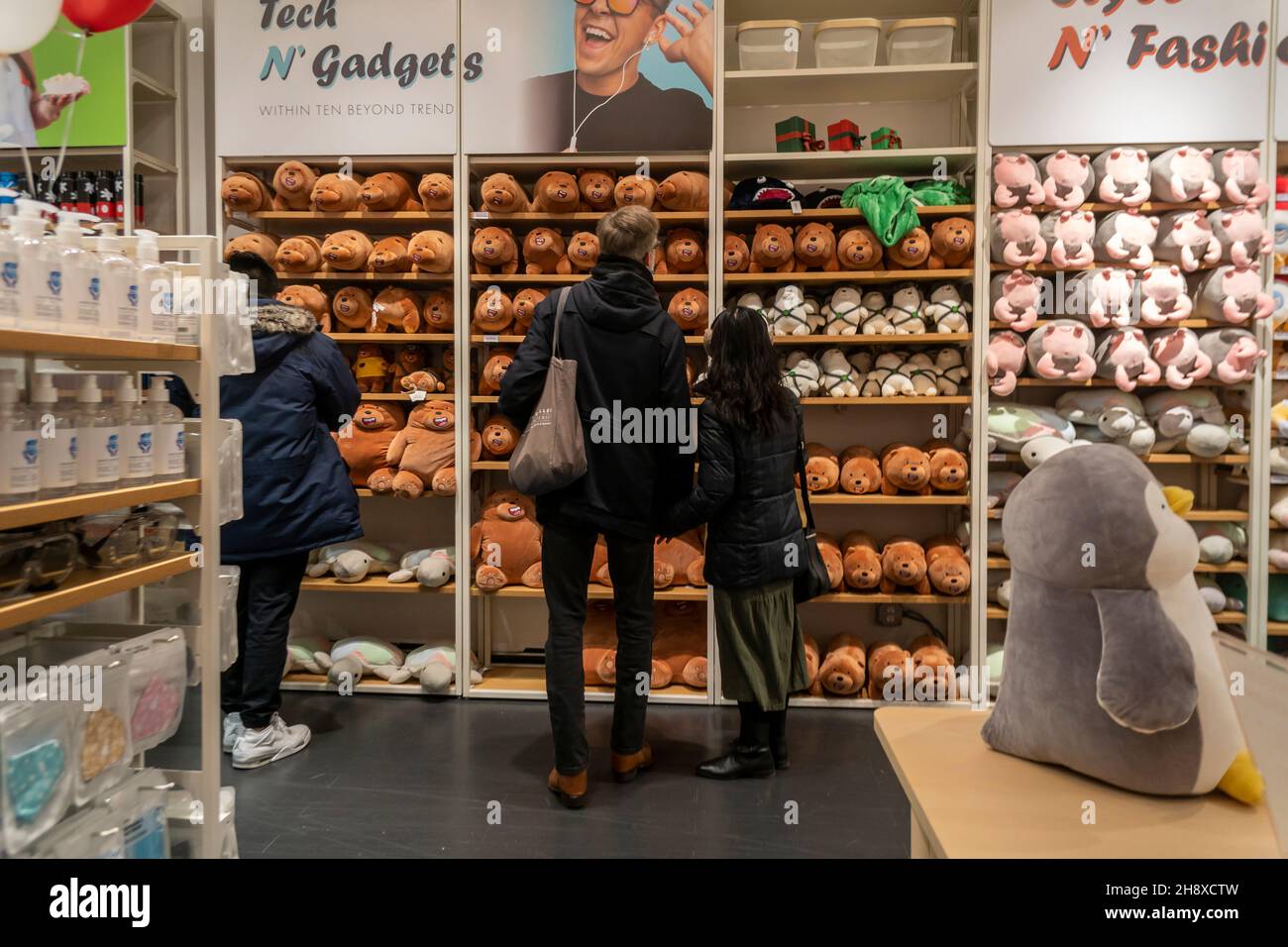 Shoppers browse merchandise in the pop-up store of Miniso in Soho in ...
