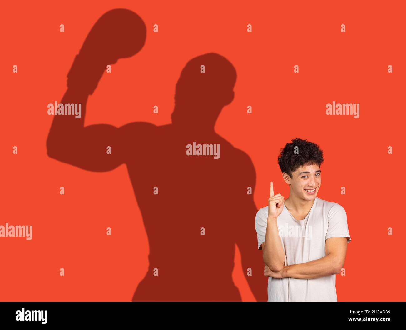 Young man thinking about famous sport future. Conceptual image with ...