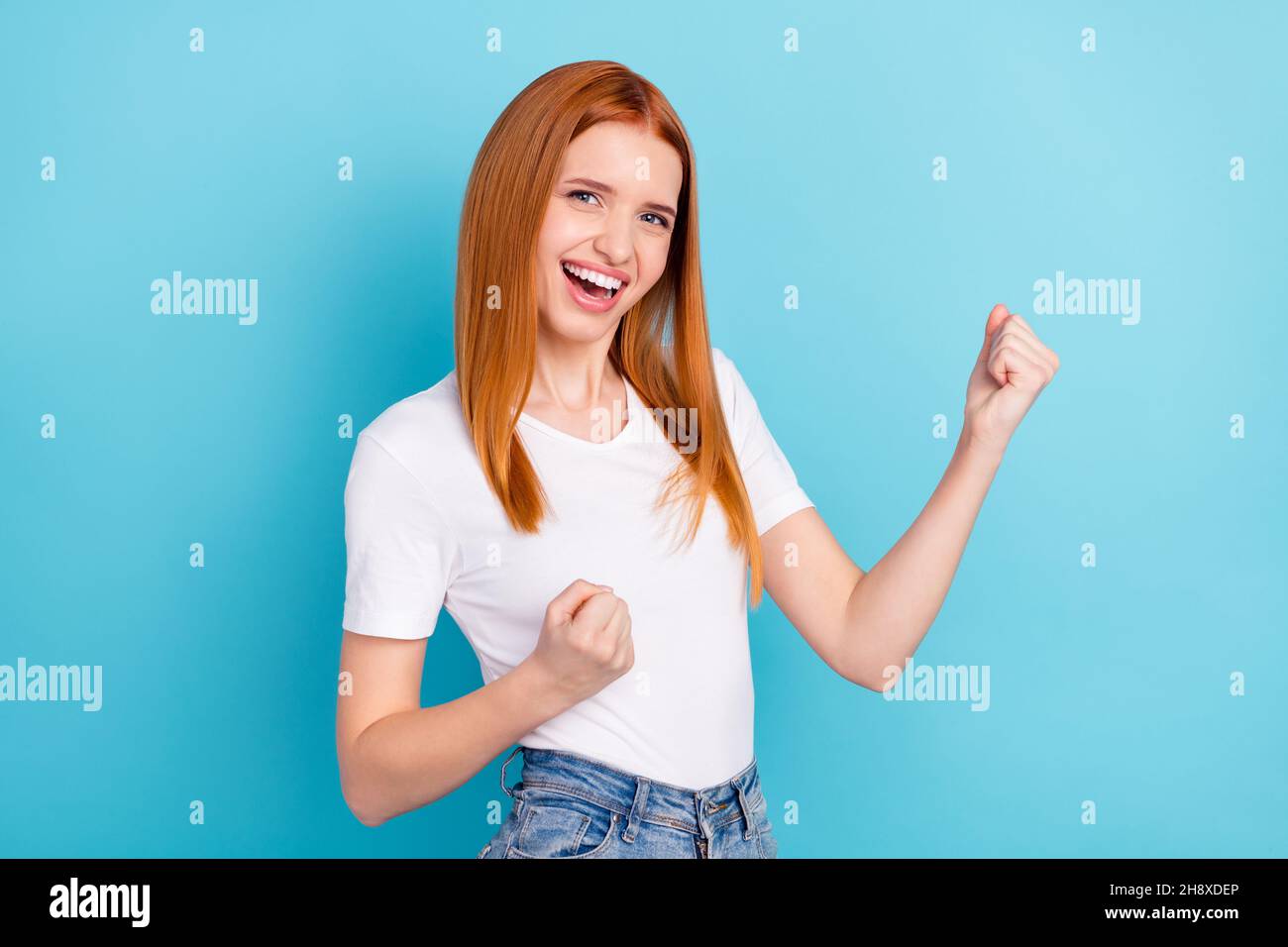 Portrait of impressed cheerful person fists up open mouth scream yeah ...
