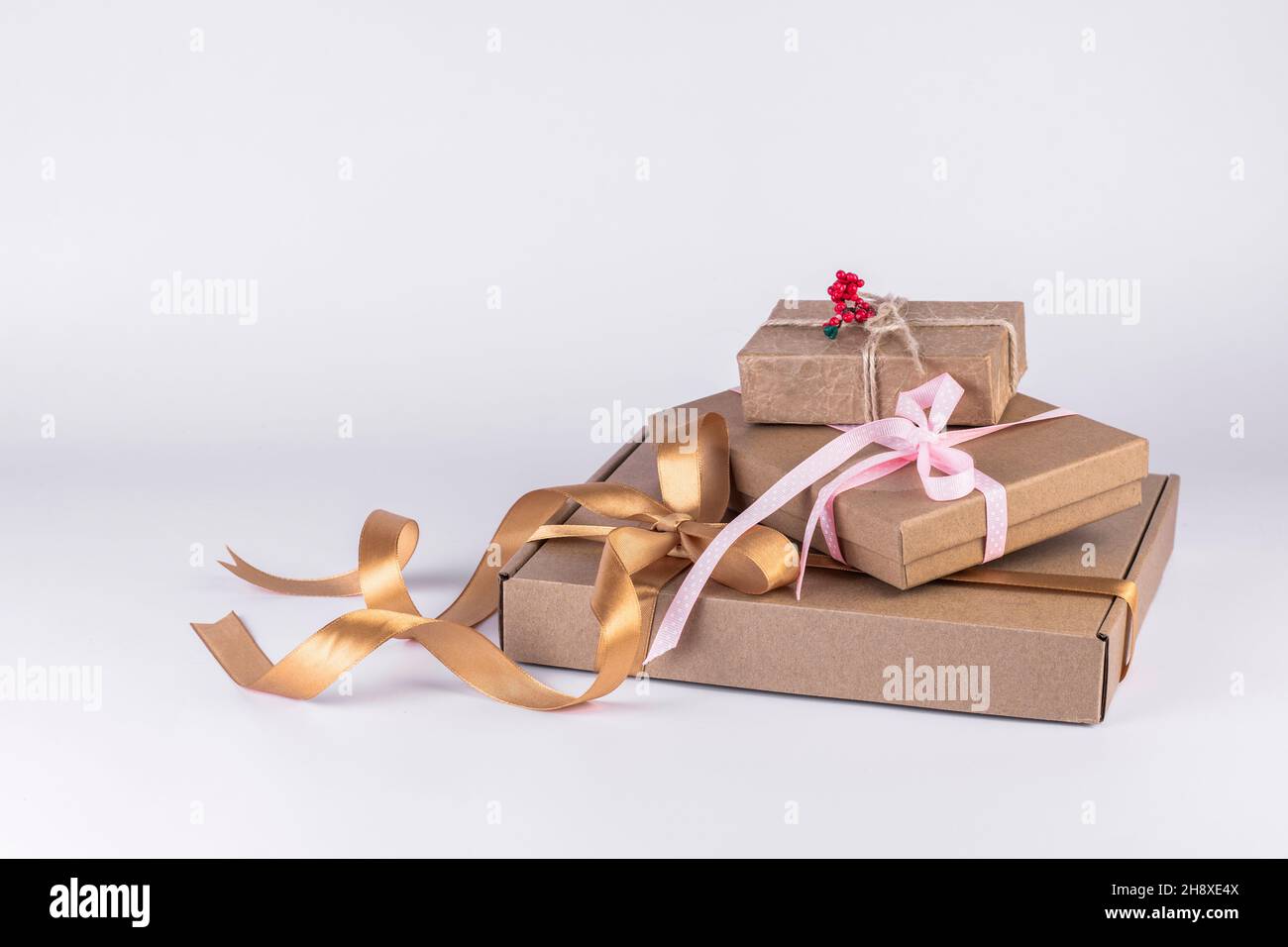 Holiday or Christmas gift boxes background. Gift box wrapped in Kraft ...