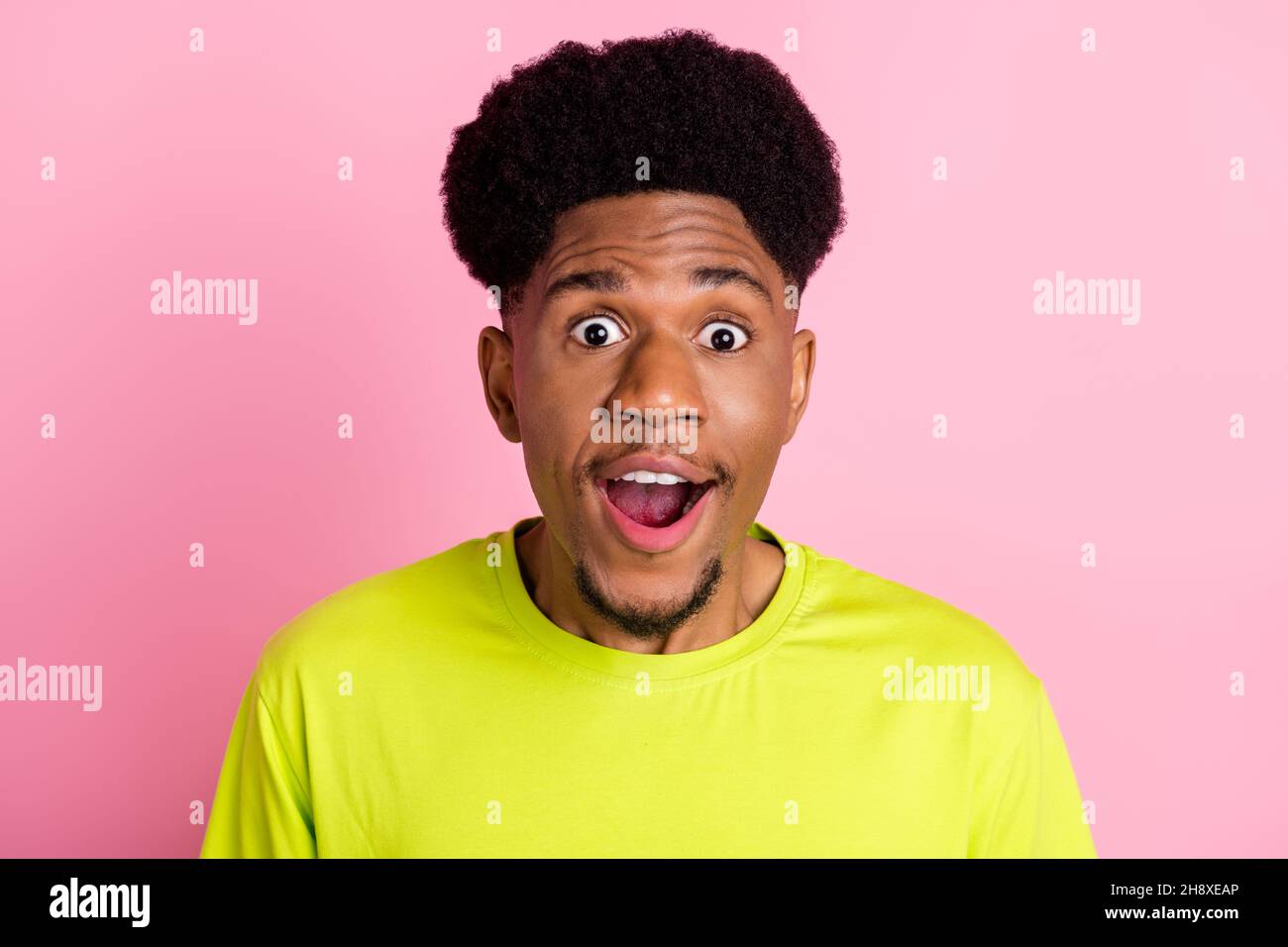 Photo of amazed shocked happy dark skin man reaction news face isolated ...