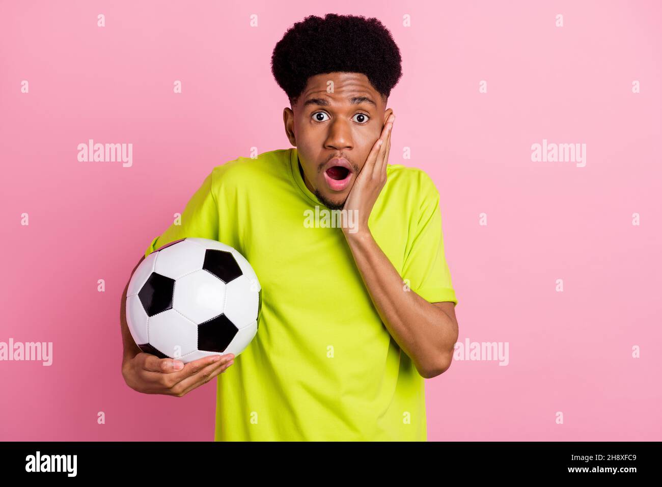 Photo of young african guy amazed shocked surprised hand touch cheek ...