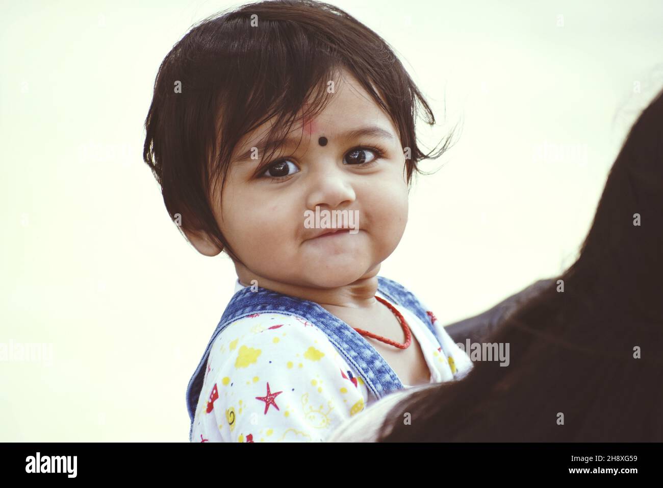 Portrait of a cute Indian baby with a bindi mark Stock Photo - Alamy