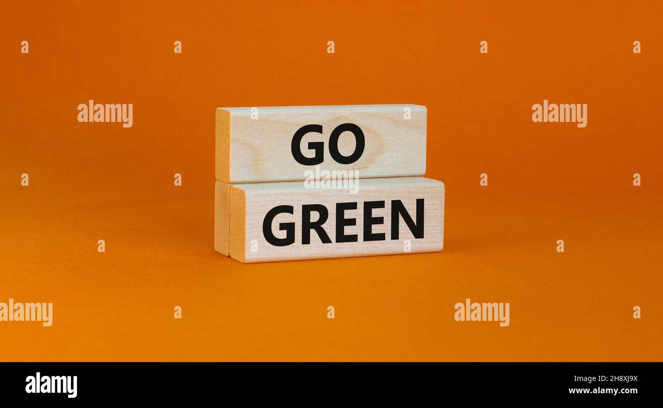 Time to go green ecology symbol. Concept words Go green on wooden ...