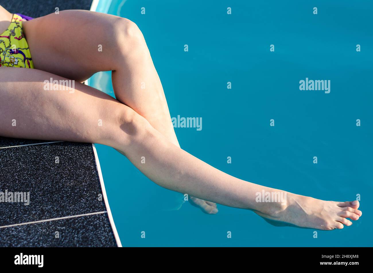 Female feet in the pool close-up. Summer vacation concept Stock Photo ...