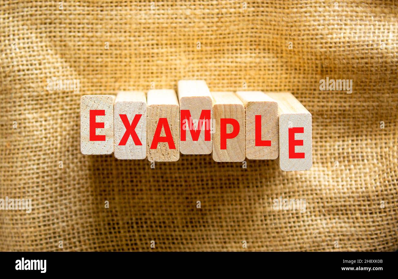 Example symbol. The concept word Example on wooden blocks. Beautiful ...