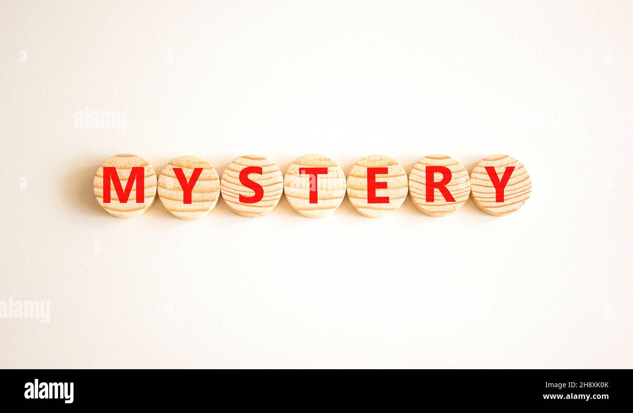 Mystery symbol. The concept word Mystery on wooden circles. Beautiful ...