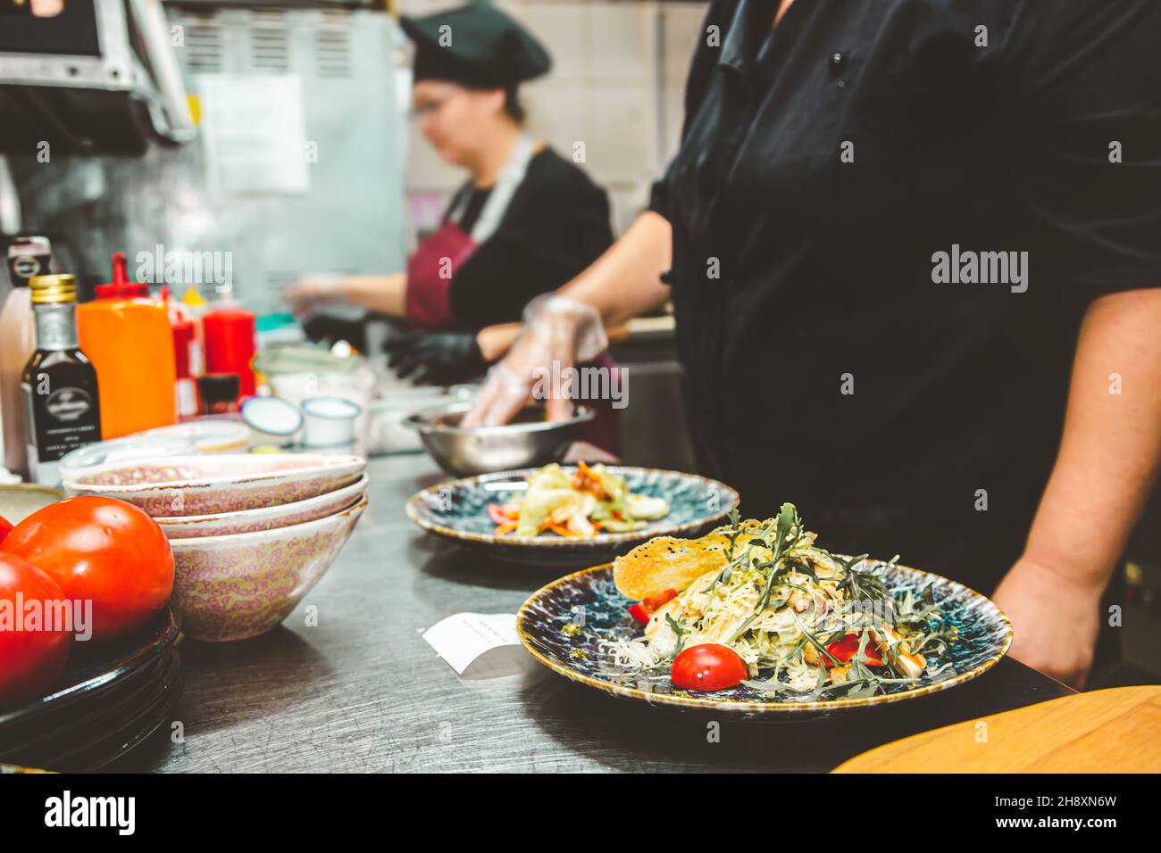 Professional chef cooking in the kitchen restaurant at the hotel ...