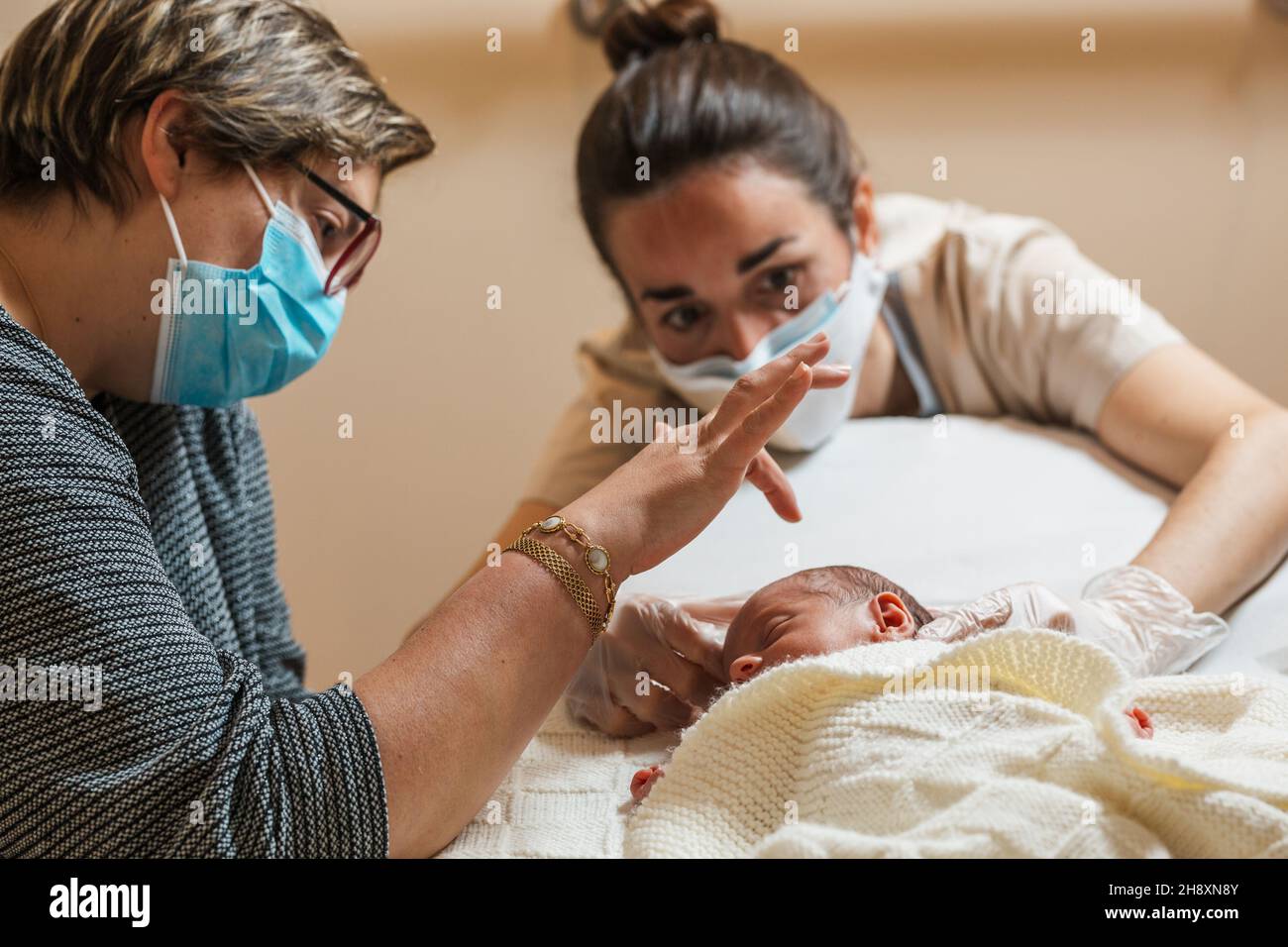 Professional physiotherapist doing an assessment of the Bregmatic and ...