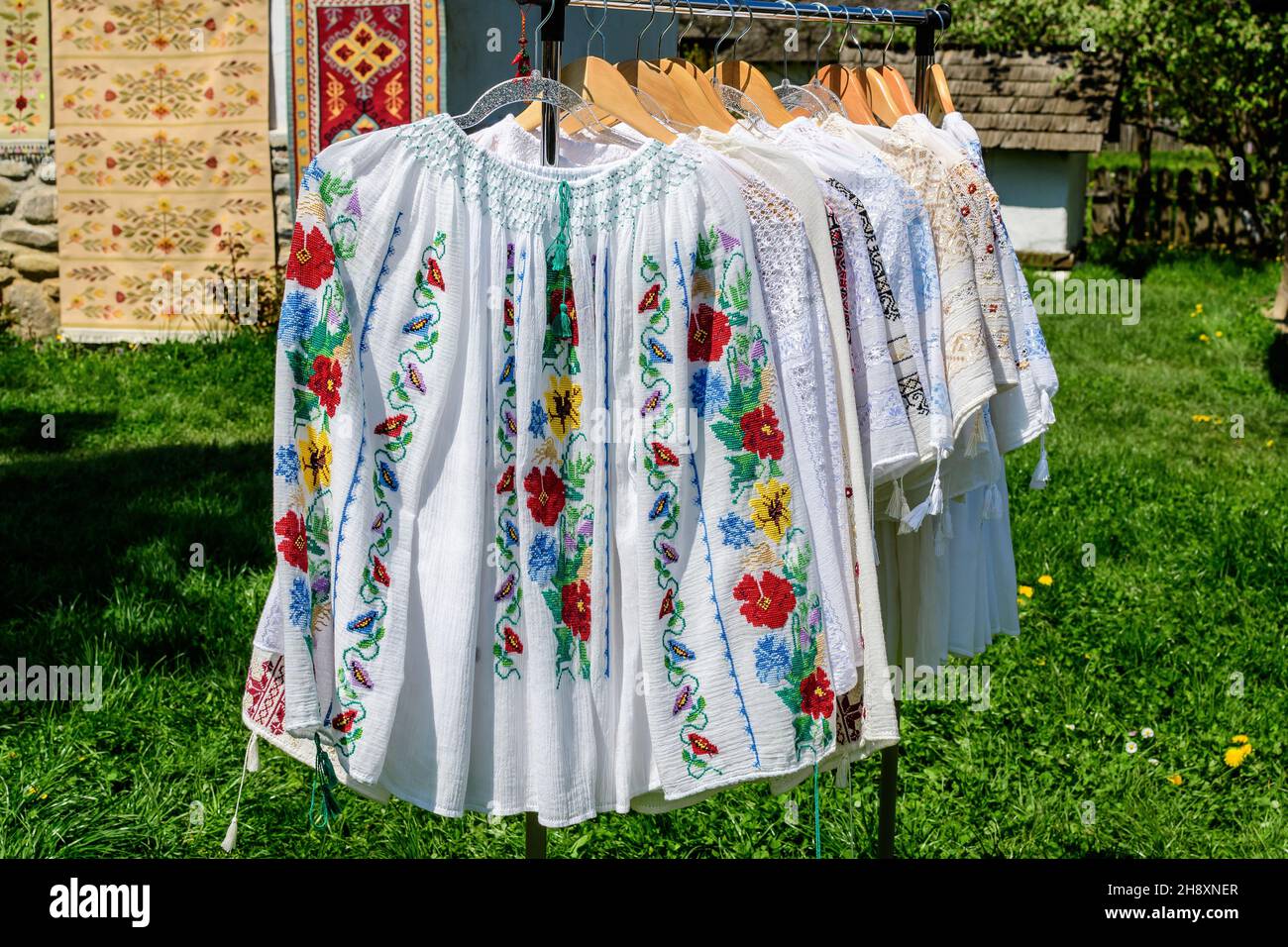 Traditional Romanian hand made clothes displayed for sale at a hand ...