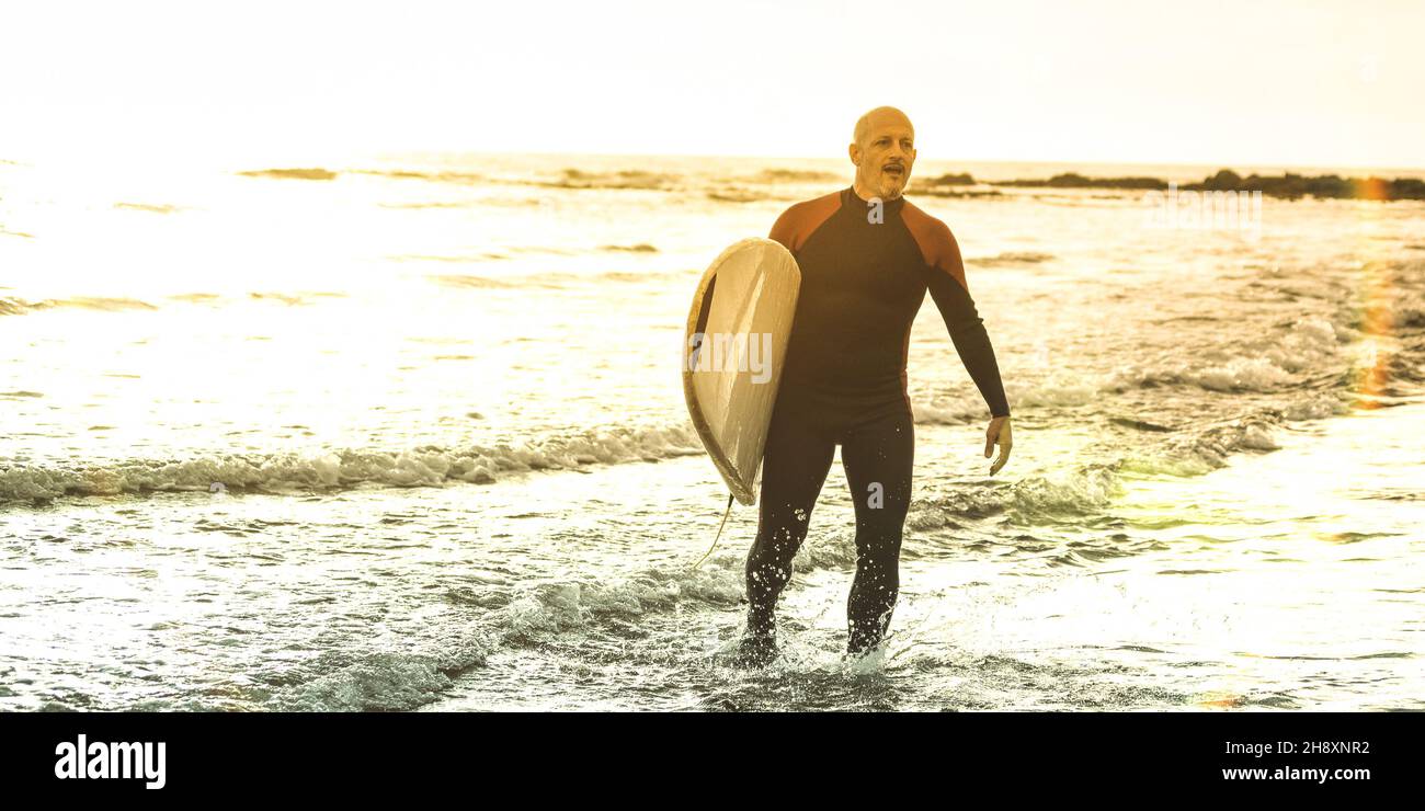 Man walking surfboard hi-res stock photography and images - Alamy