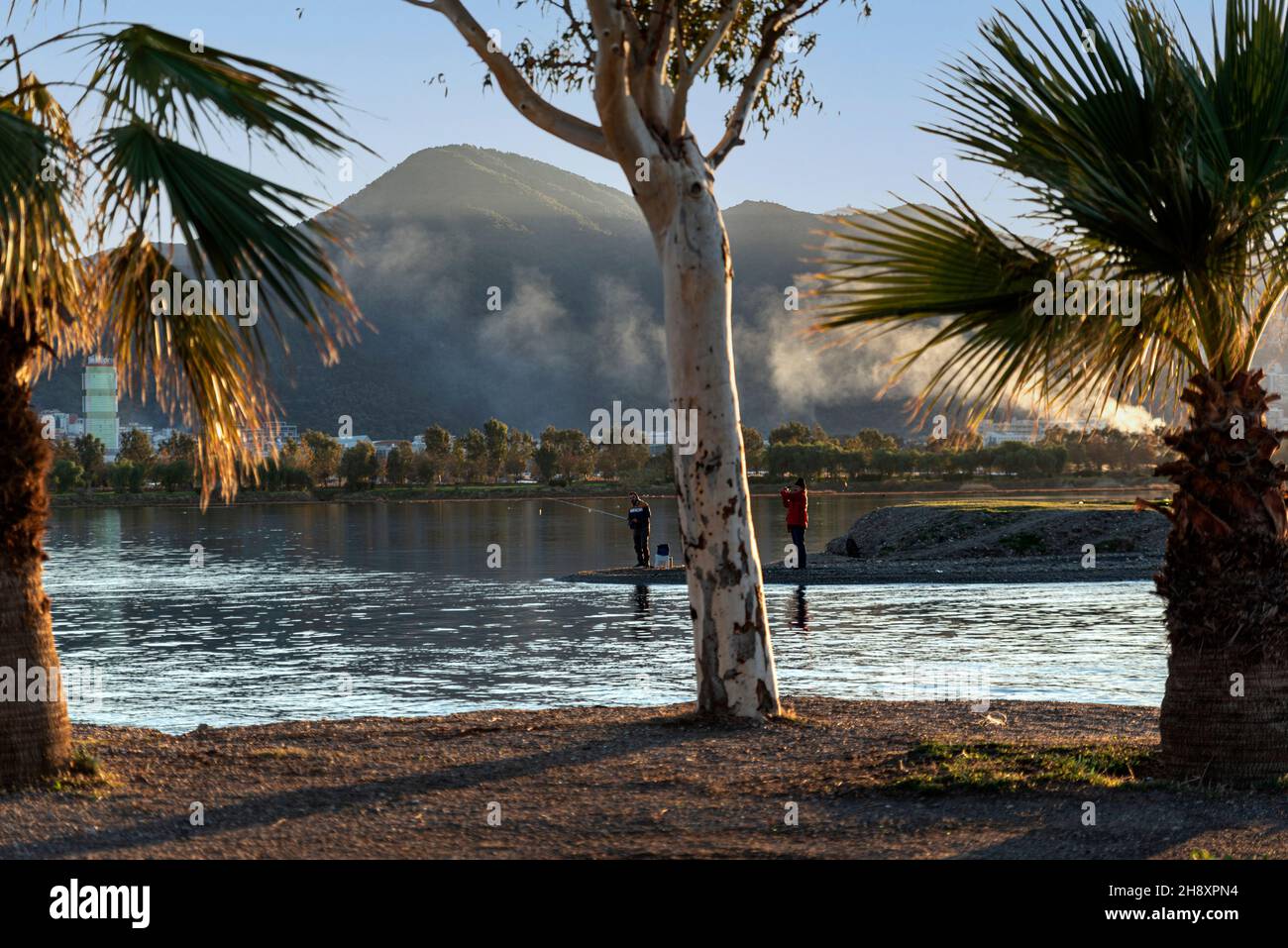 Coastal fishermen fishing under Baris Manco bridge in Izmir urban ...