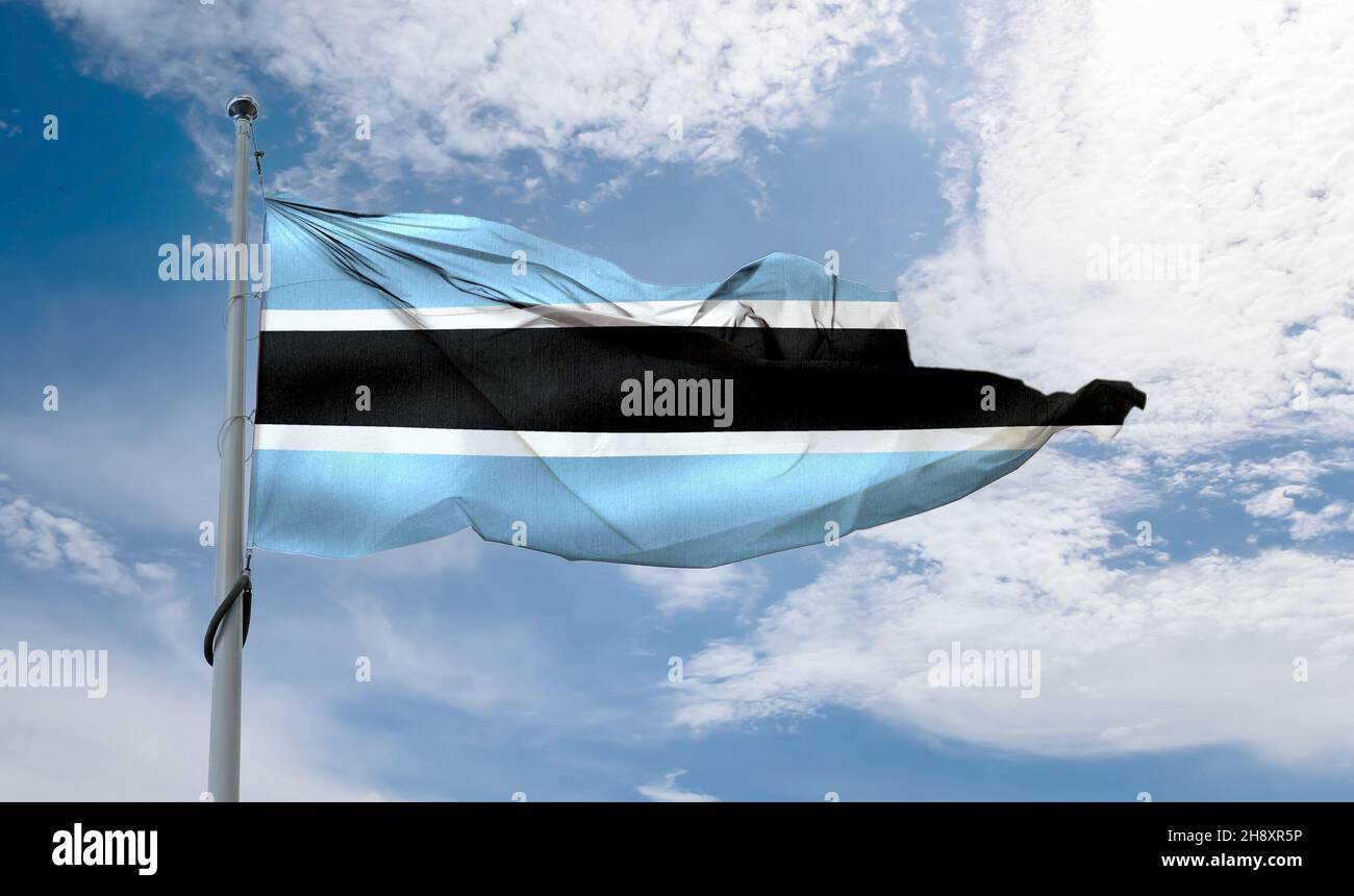Botswana flag waving on a pole in a blue sky Stock Photo - Alamy