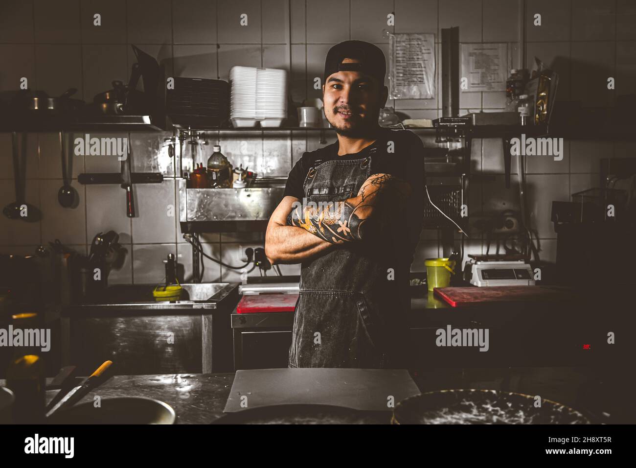 Male cook stands kitchen table hi-res stock photography and images - Alamy