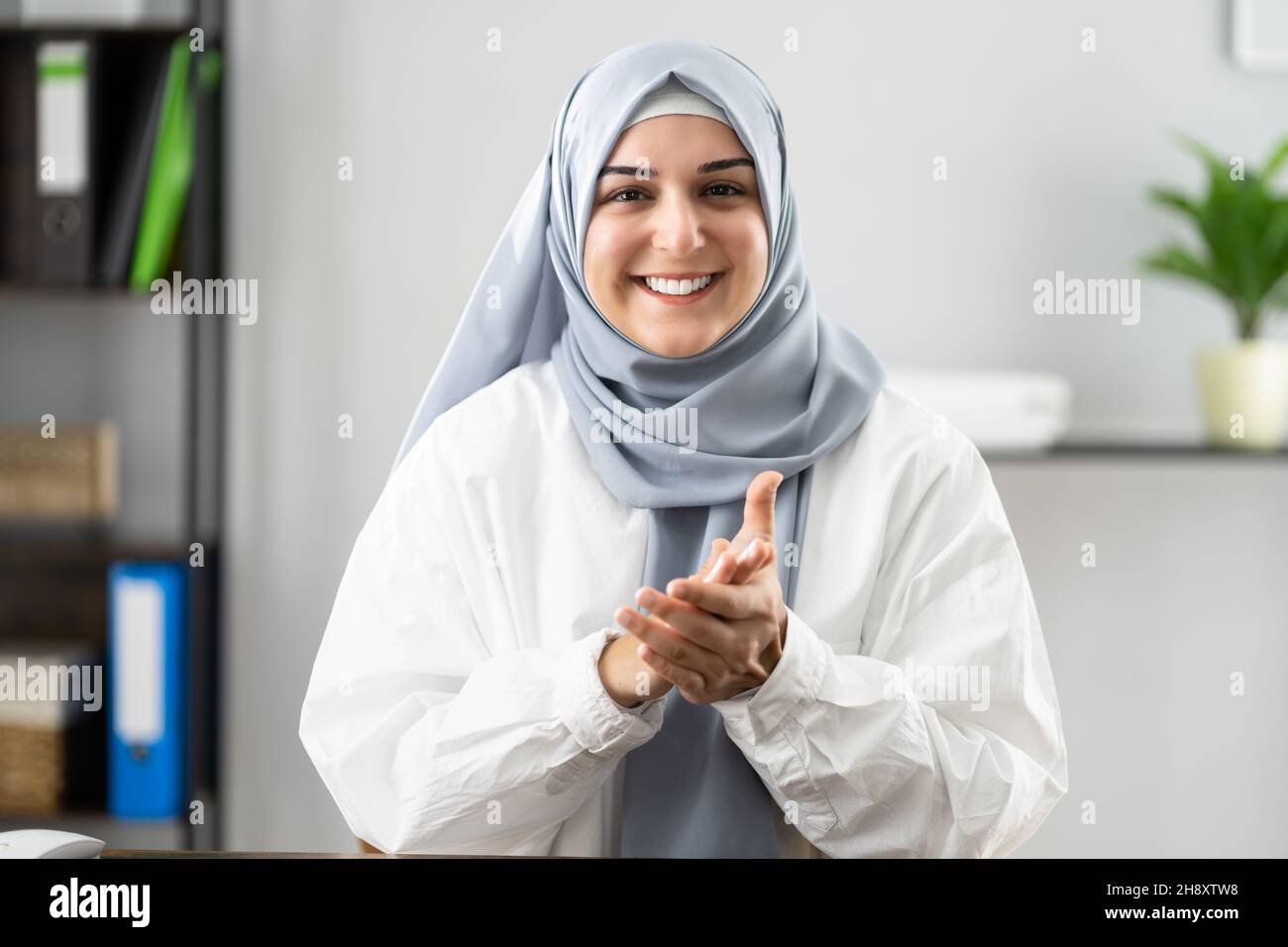 Happy Muslim Woman In Online Interview Conference Call Stock Photo - Alamy